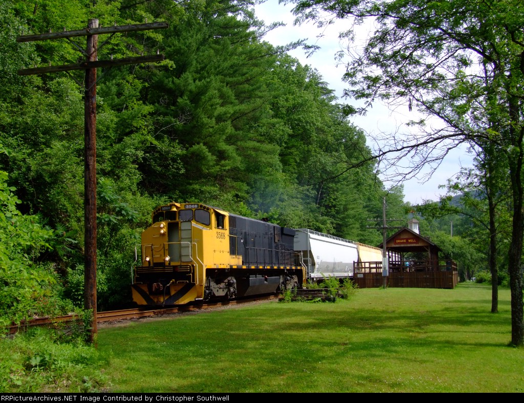 OCTL 3568 leads a northbound mixed train through the station at Drake Well Date approximate ...